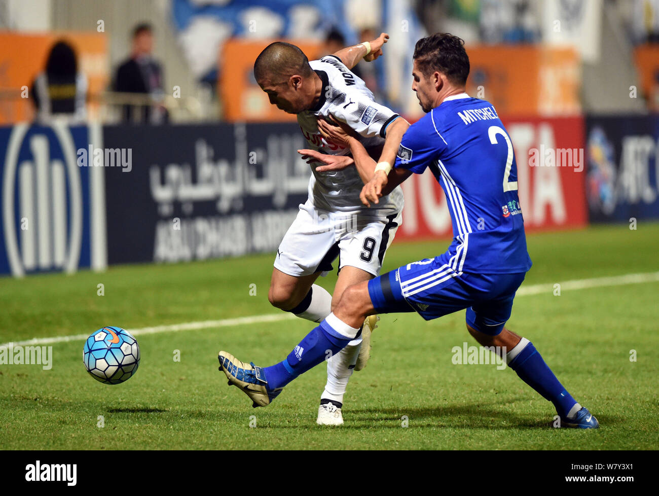Takayuki Morimoto of Japan's Kawasaki Frontale, left, challenges Josh ...