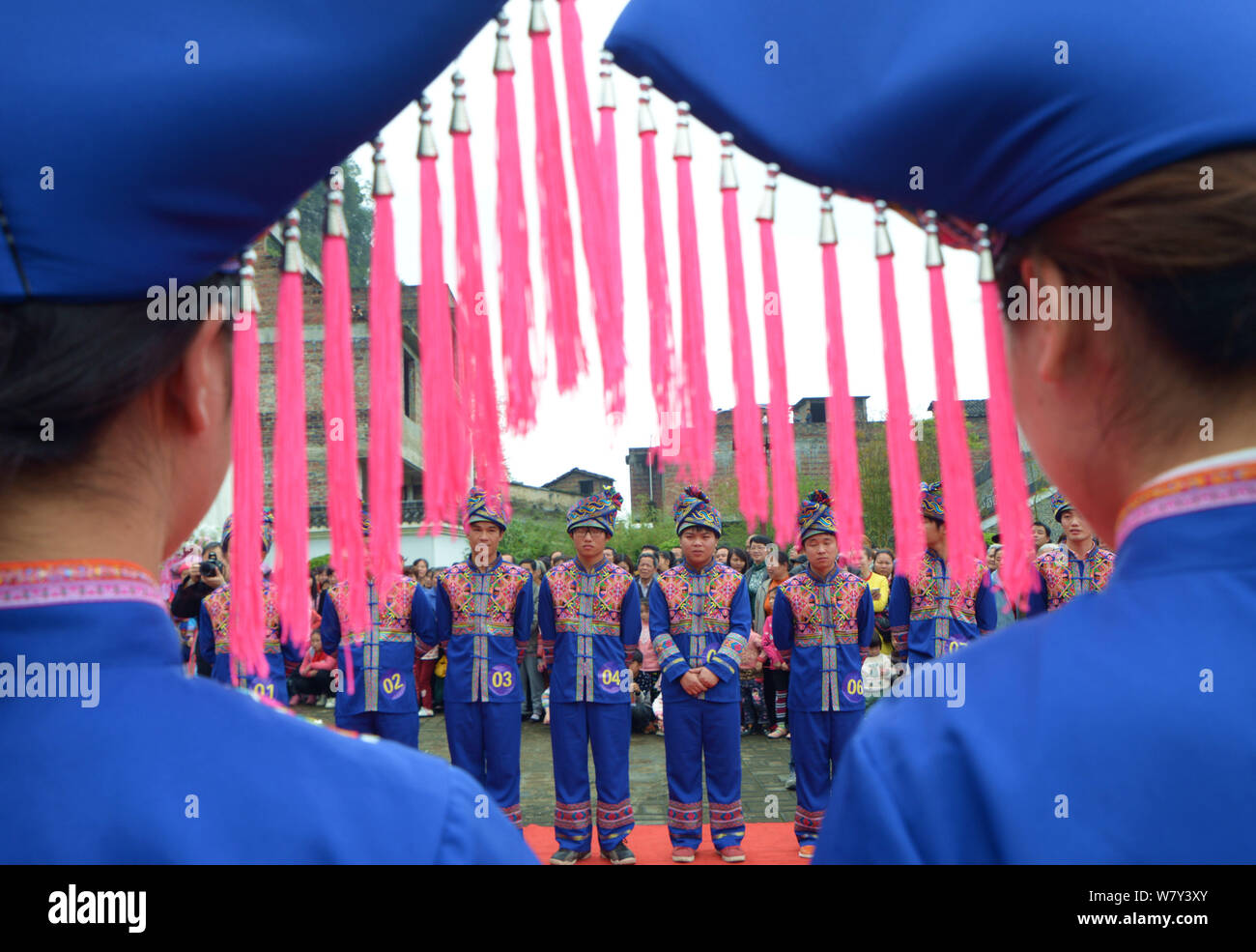 Couples of Chinese Zhuang ethnic group dressed in traditional costumes ...