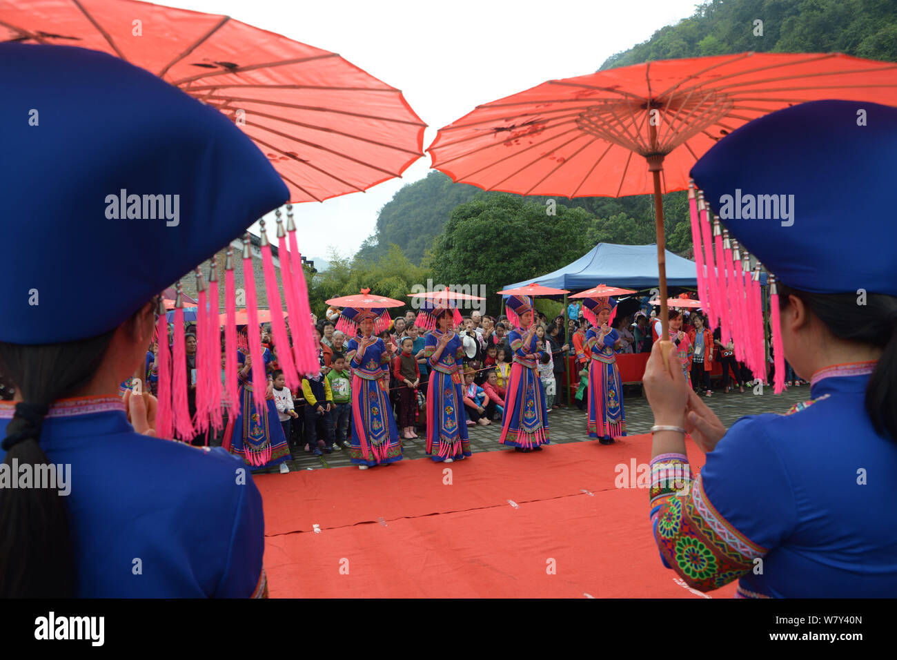 Couples of Chinese Zhuang ethnic group dressed in traditional costumes ...