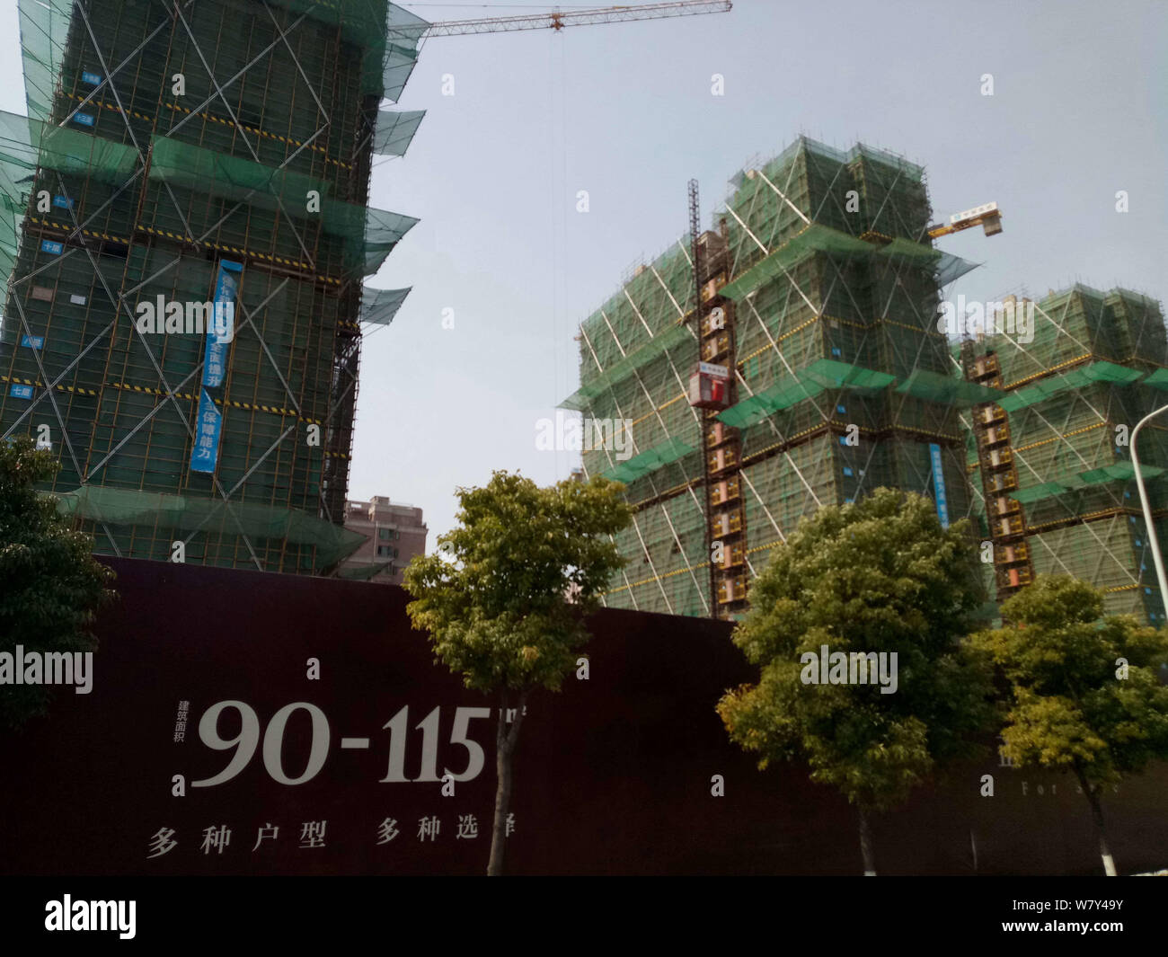 --FILE--View of high-rise apartment buildings at the construction site ...