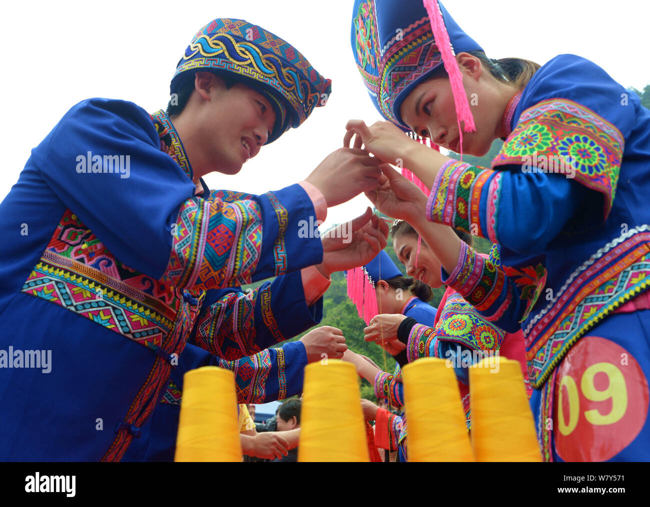 Couples of Chinese Zhuang ethnic group dressed in traditional costumes ...