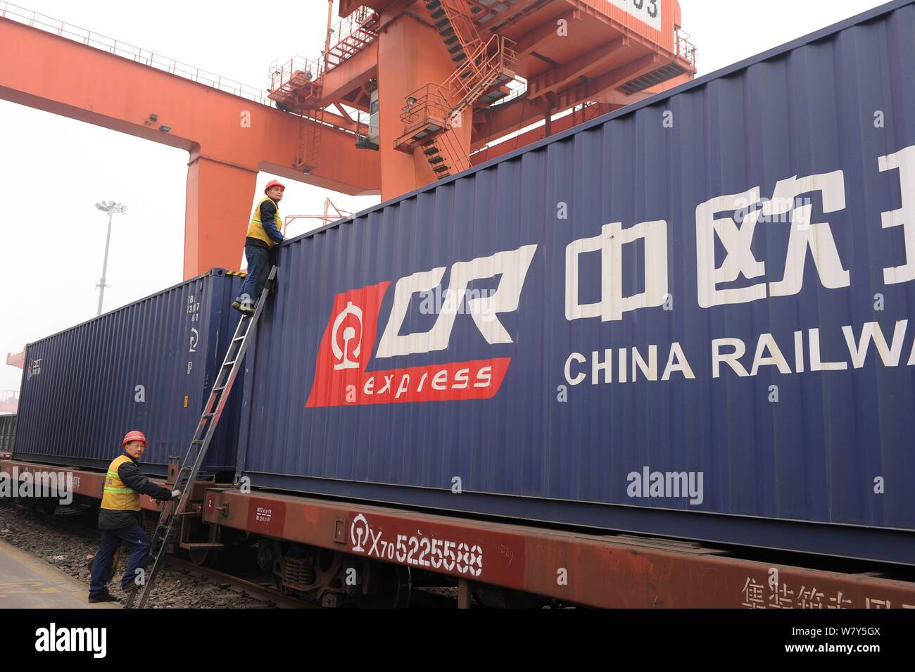 --FILE--Chinese workers check a container of China Railway Express at a ...