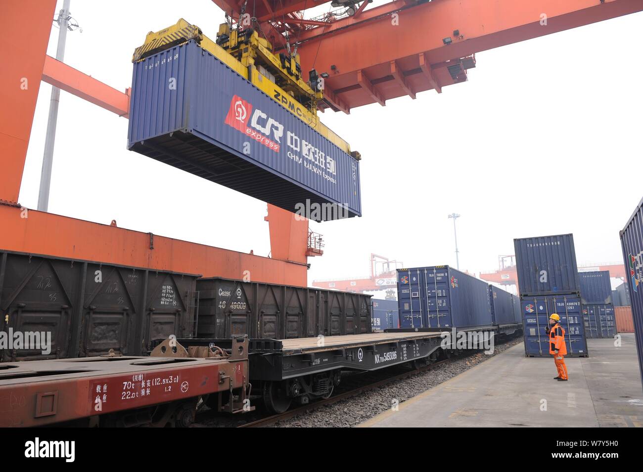 --FILE--A Chinese worker watches a container of China Railway Express ...