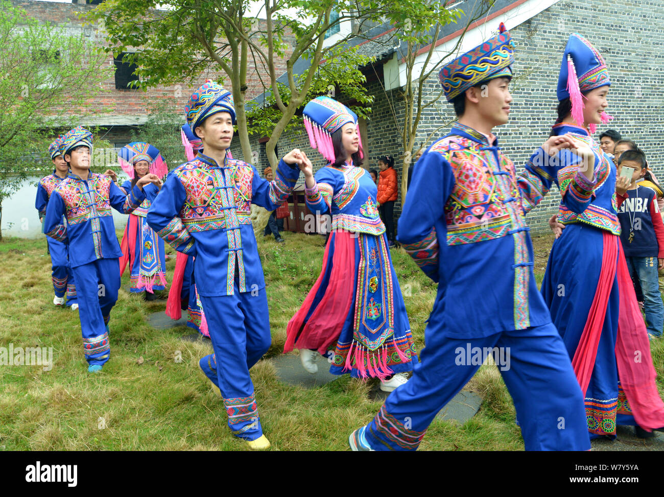 Couples of Chinese Zhuang ethnic group dressed in traditional costumes ...