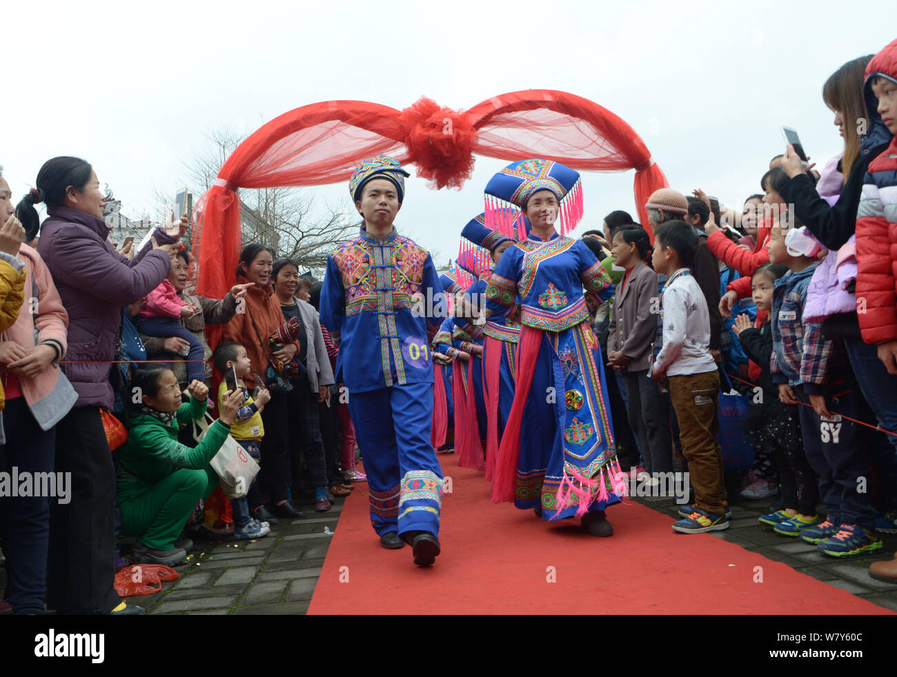 Couples of Chinese Zhuang ethnic group dressed in traditional costumes ...
