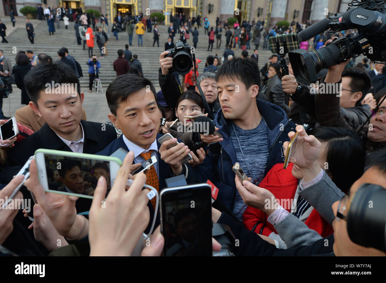 Robin Li Yanhong, center, Chairman and CEO of Baidu, is surrounded by ...