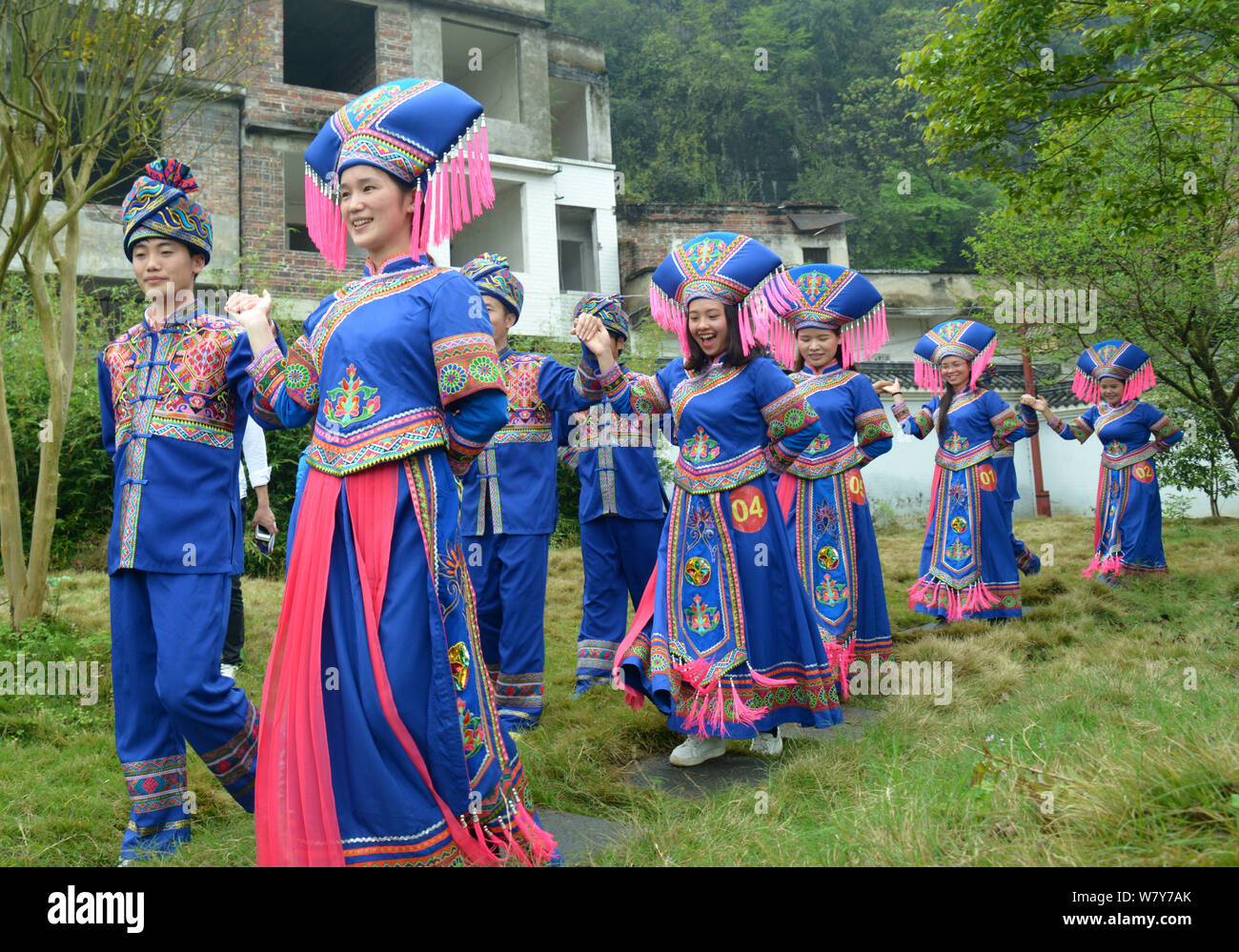 Couples of Chinese Zhuang ethnic group dressed in traditional costumes ...
