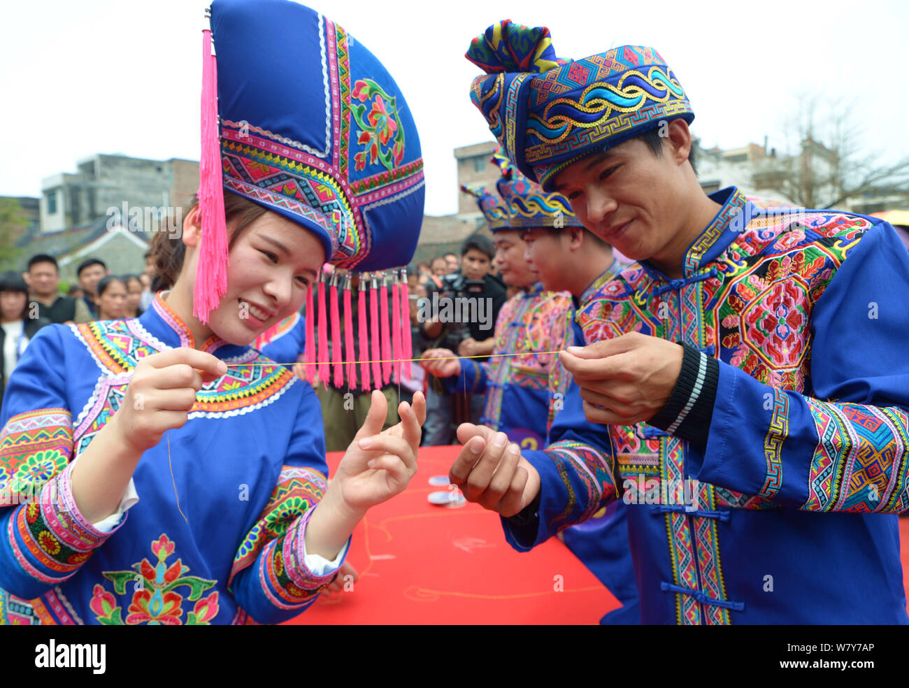 Couples of Chinese Zhuang ethnic group dressed in traditional costumes ...