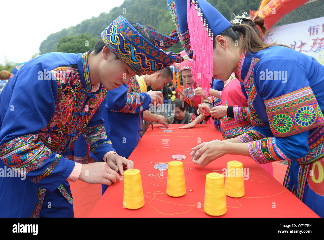 Couples of Chinese Zhuang ethnic group dressed in traditional costumes ...