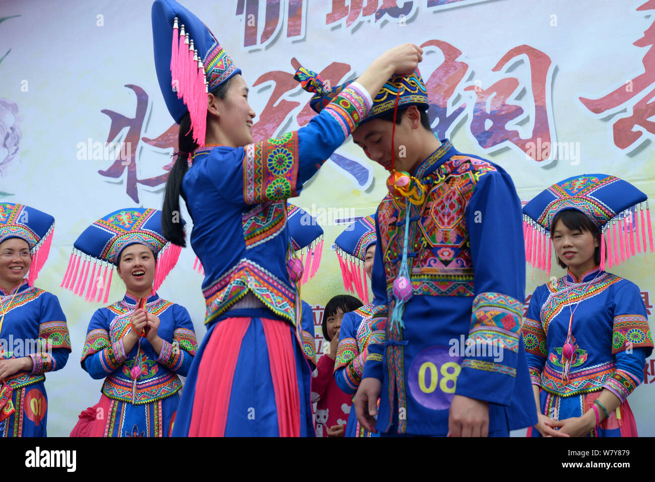 Couples of Chinese Zhuang ethnic group dressed in traditional costumes ...