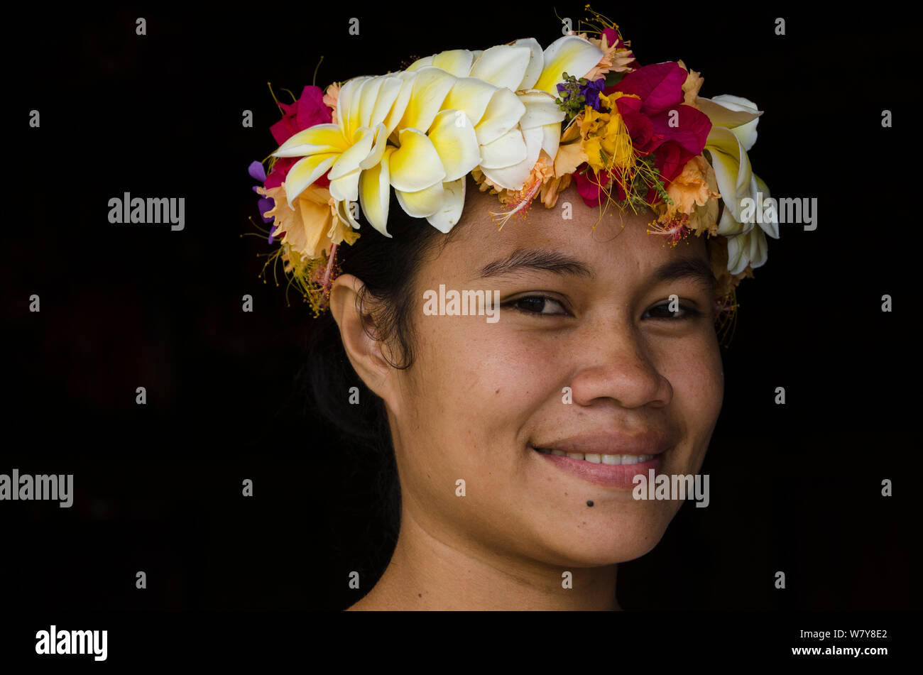 Woman wearing traditional floral headdress for ceremony, Kioa Island ...