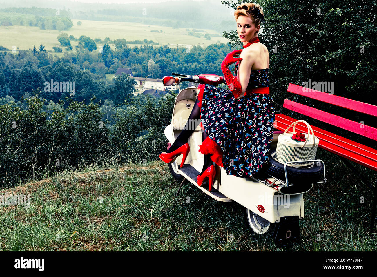 A young woman in the 60s, sitting on a Heinkel scooter, beautifully ...