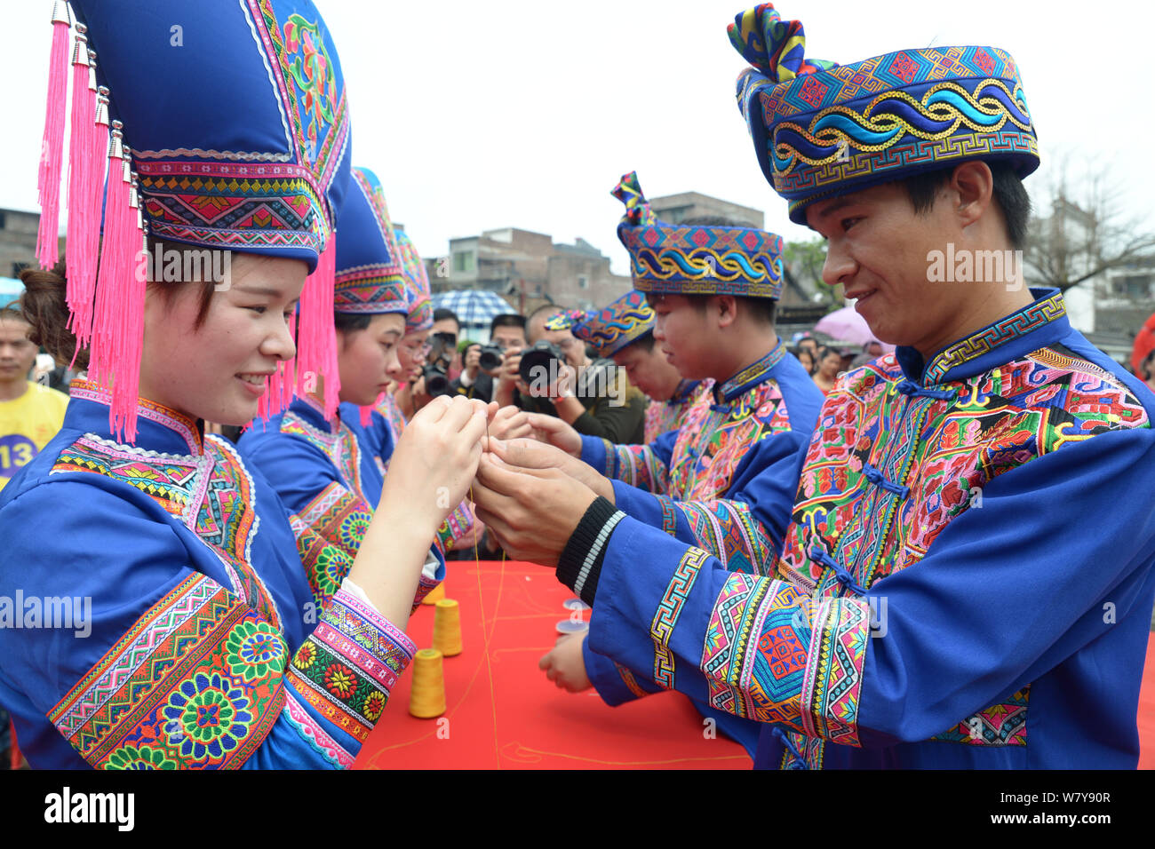 Couples of Chinese Zhuang ethnic group dressed in traditional costumes ...
