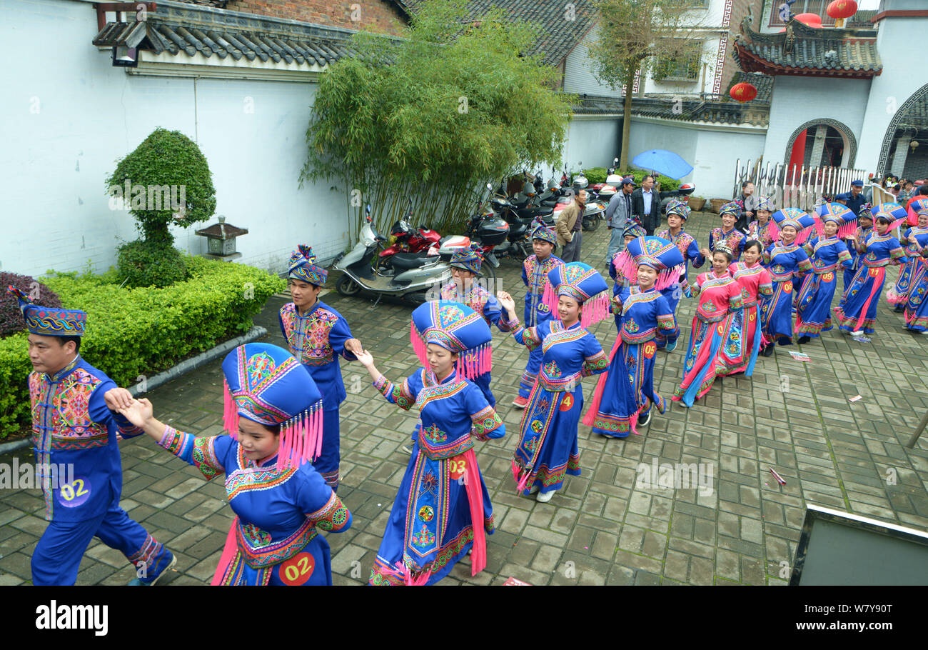 Couples of Chinese Zhuang ethnic group dressed in traditional costumes ...