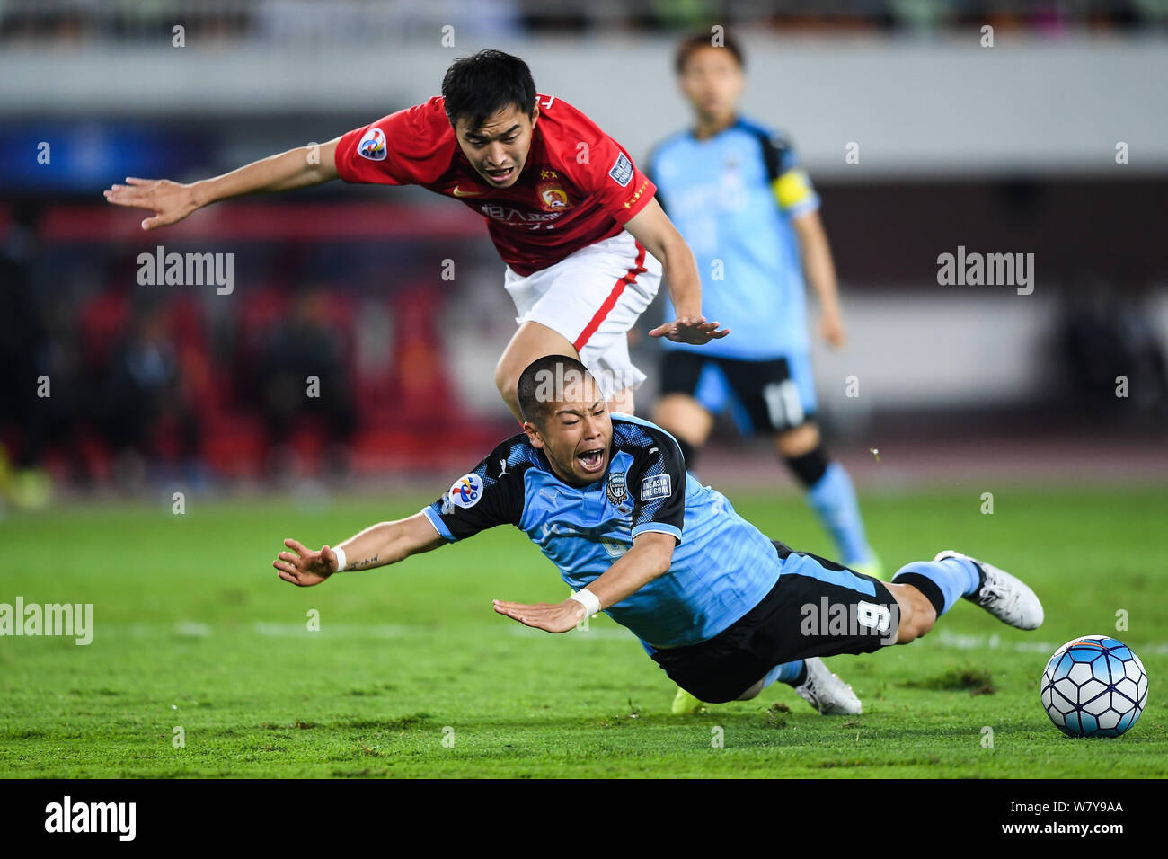 Feng Xiaoting of China's Guangzhou Evergrande F.C., top, challenges ...
