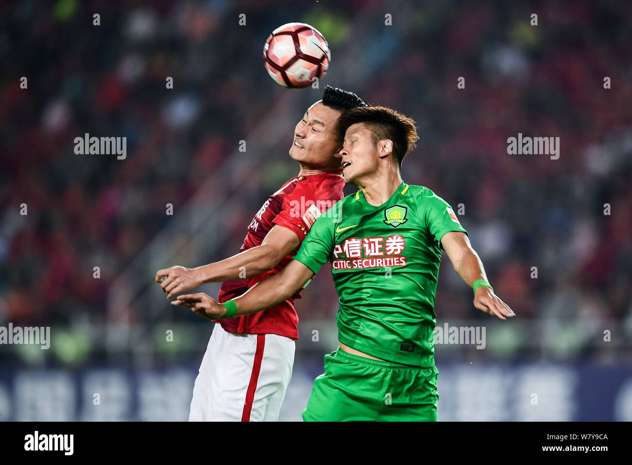 Gao Lin of Guangzhou Evergrande F.C., left, challenges Yu Yang of ...