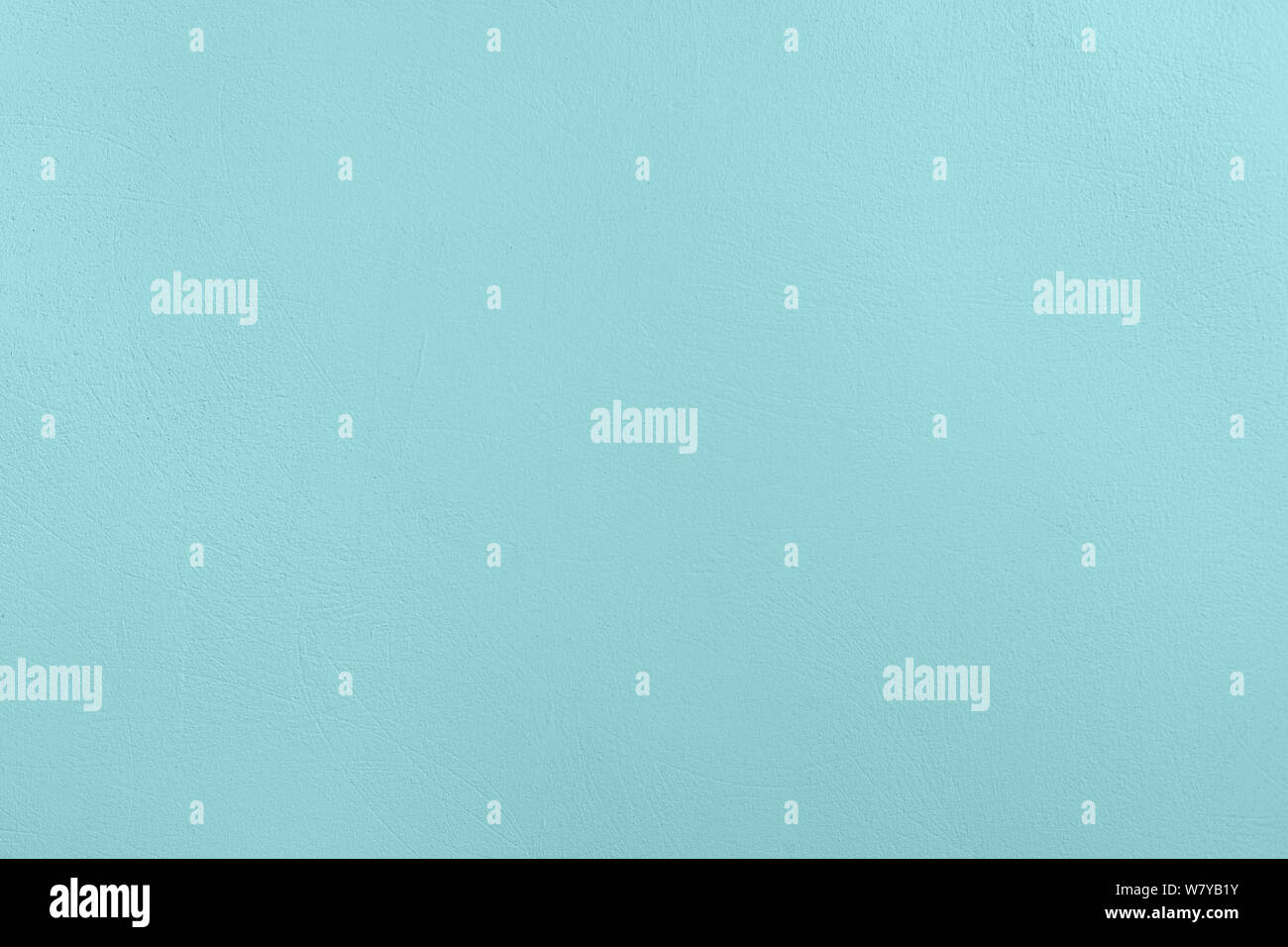 Pale blue colored low contrast Concrete textured background with ...
