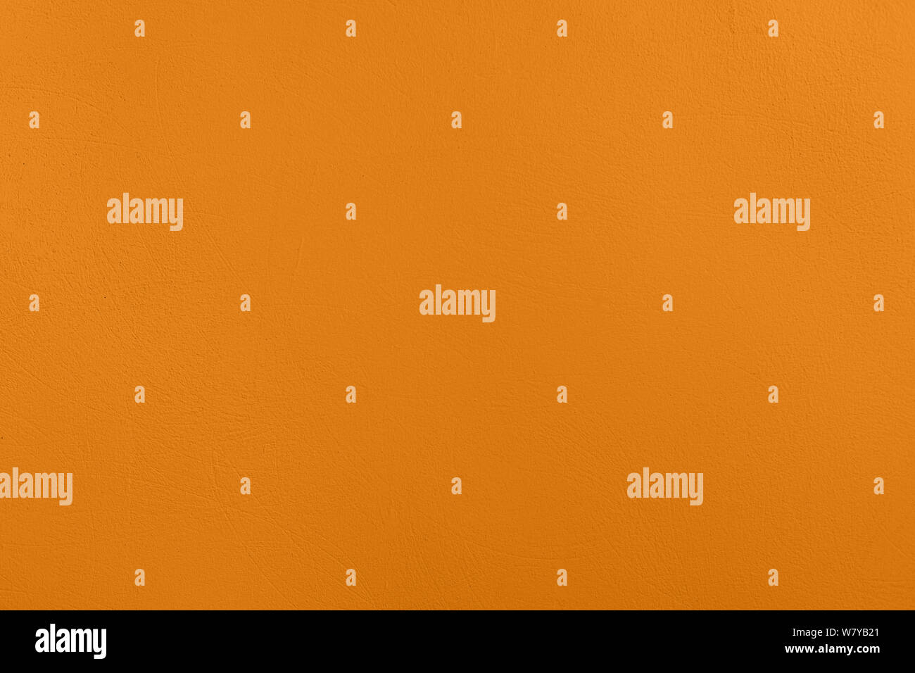 Saturated dark yellow colored low contrast Concrete textured background ...
