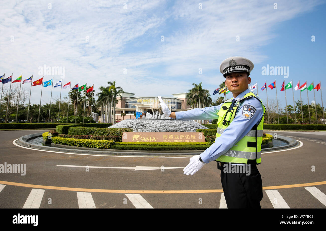 A Chinese police officer directs the traffic in front of the BFA ...