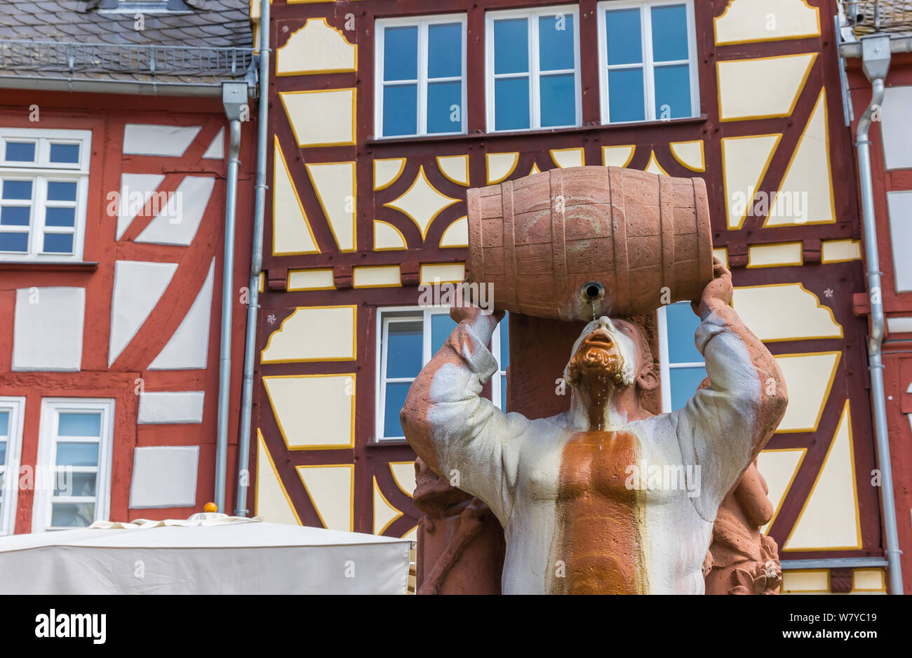 Statue of a man drinking from a barrel in Limburg an der Lahn, Germany ...