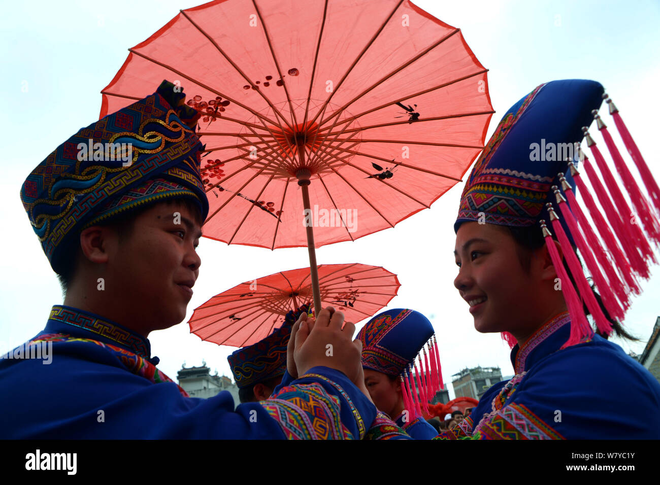 Couples of Chinese Zhuang ethnic group dressed in traditional costumes ...