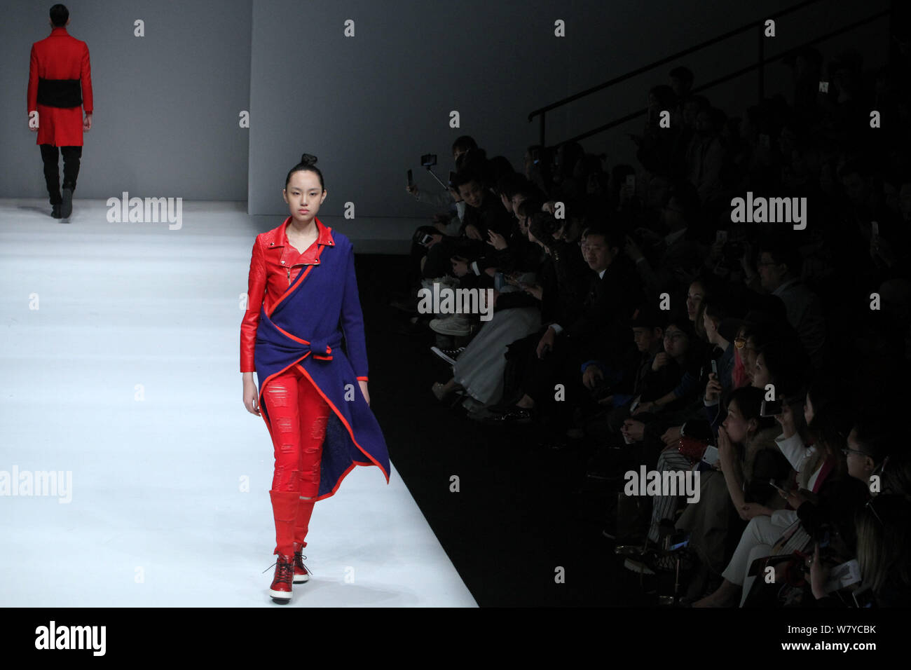 A model displays a new creation at the fashion show of HUANRAN WU by ...