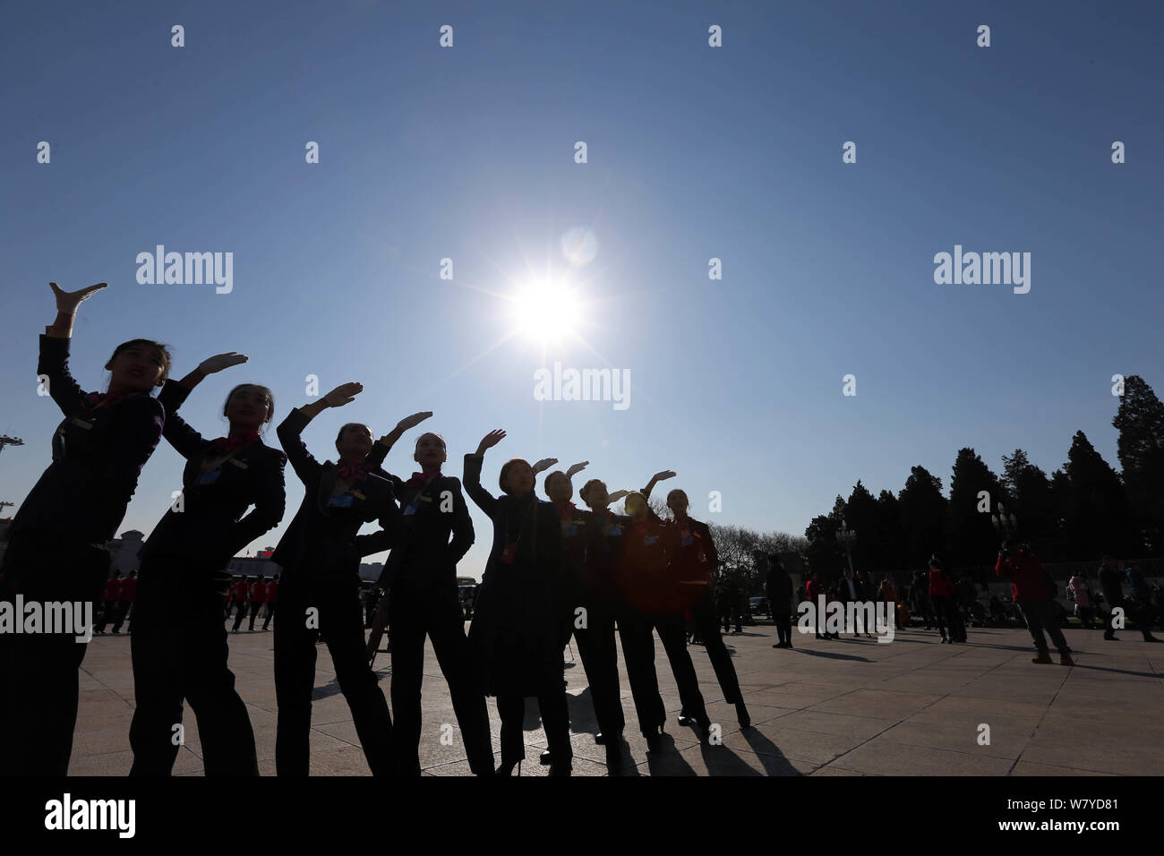 Chinese hostesses pose for photos in front of the Great Hall of the ...