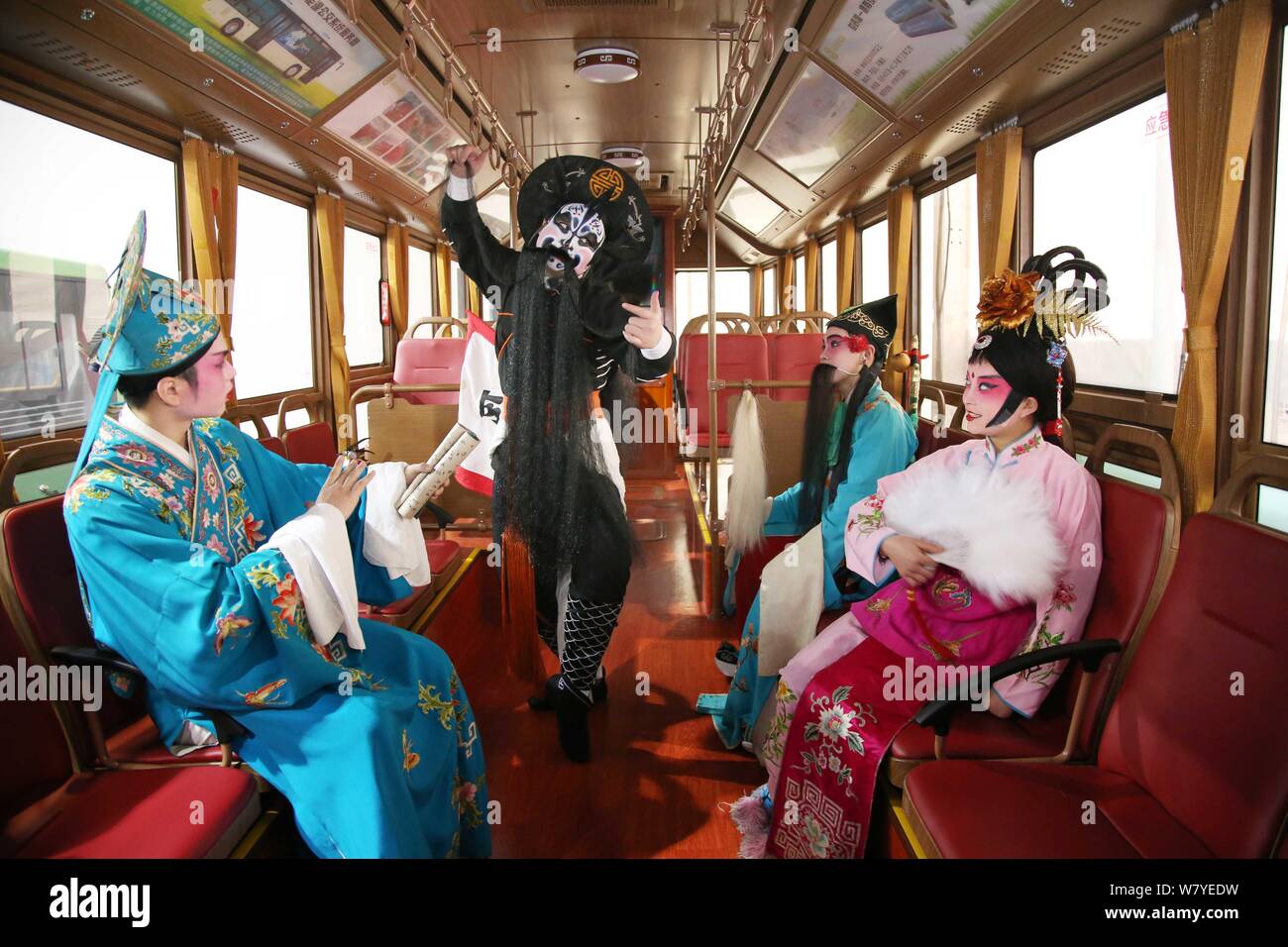 Wu Opera performers dressed in elaborate costumes and headwears pose ...