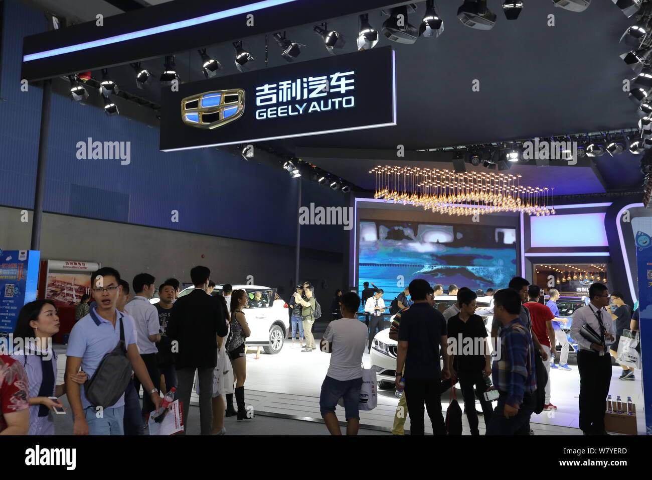 --FILE--People visit the stand of Geely during the 14th China ...