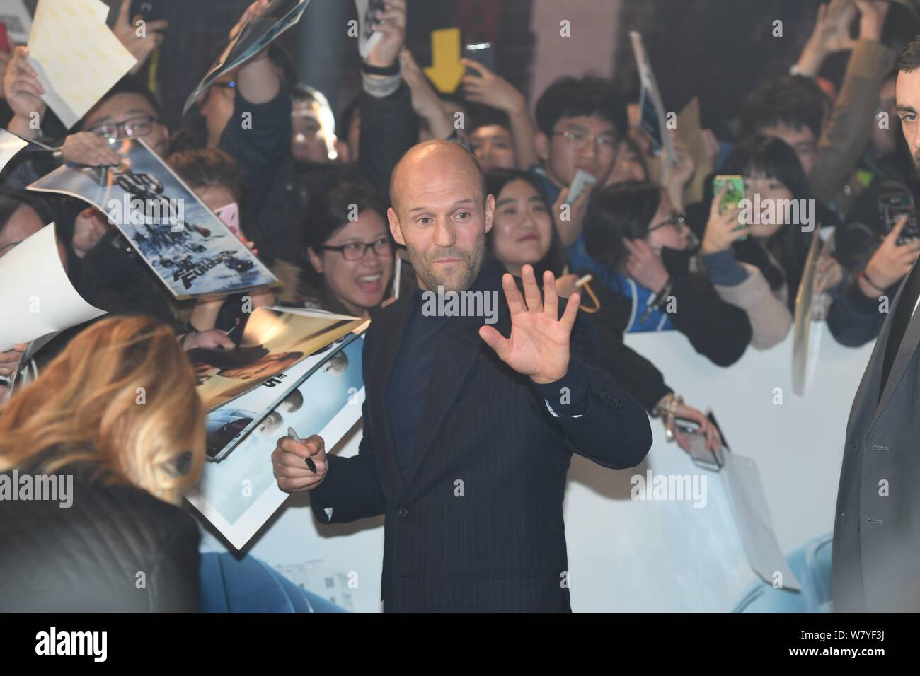 English actor Jason Statham, center, interacts with fans on the red ...