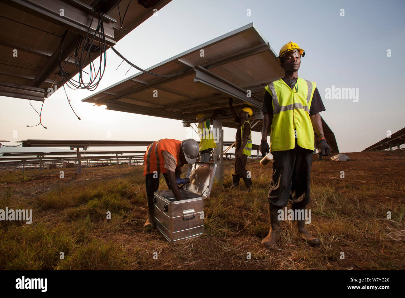 Technicians installing panels in one of East Africa's largest Solar ...