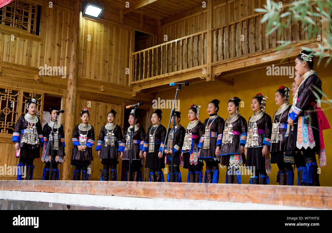 Chinese women of Dong ethnic group wearing traditional costumes perform ...