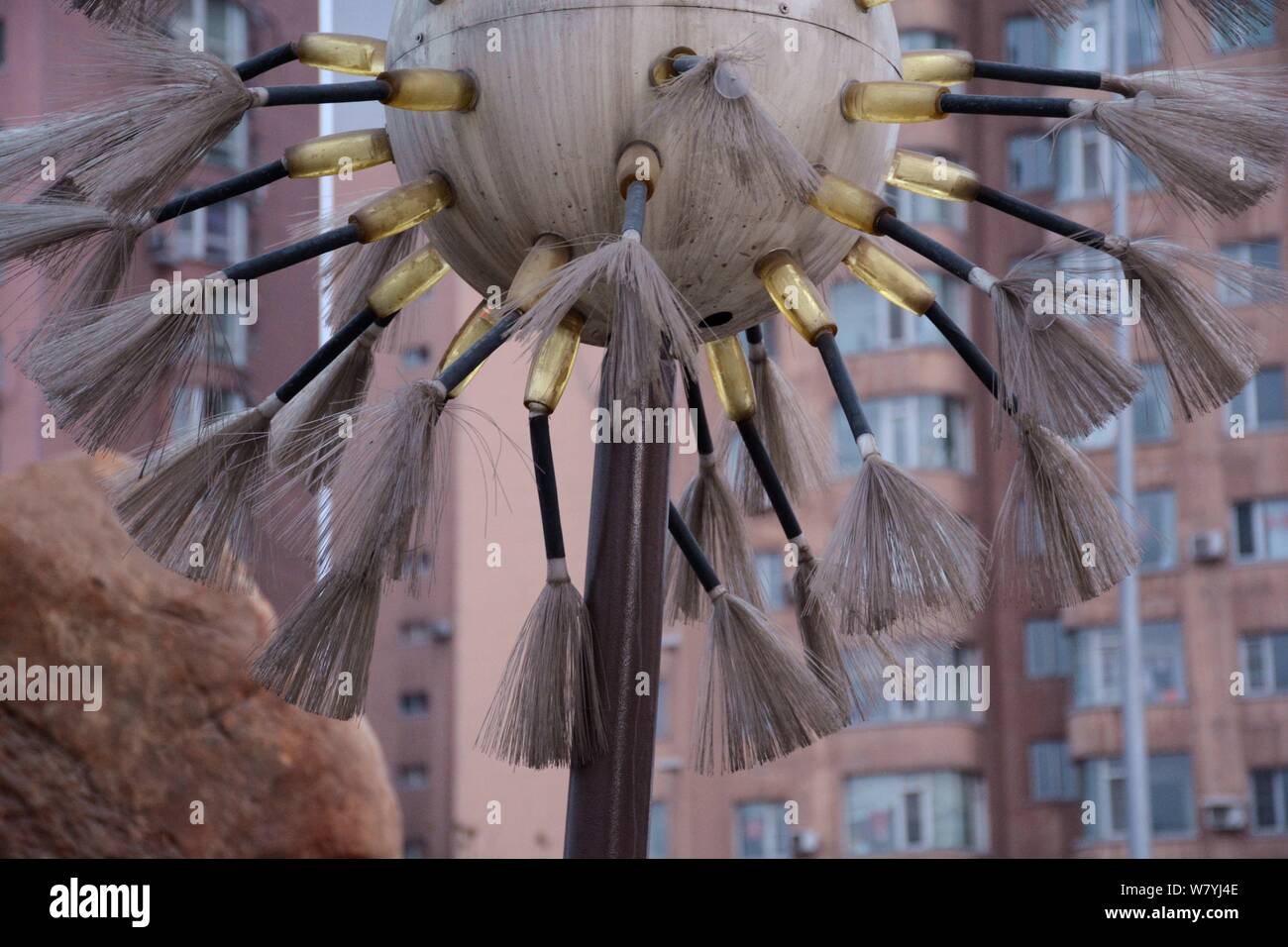 View of a spherical street lamp with clusters of optic fibers similar ...
