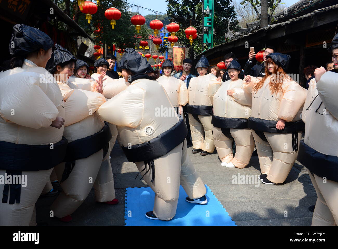 Chinese women dressed in inflatable sumo-wrestler costumes took part in ...
