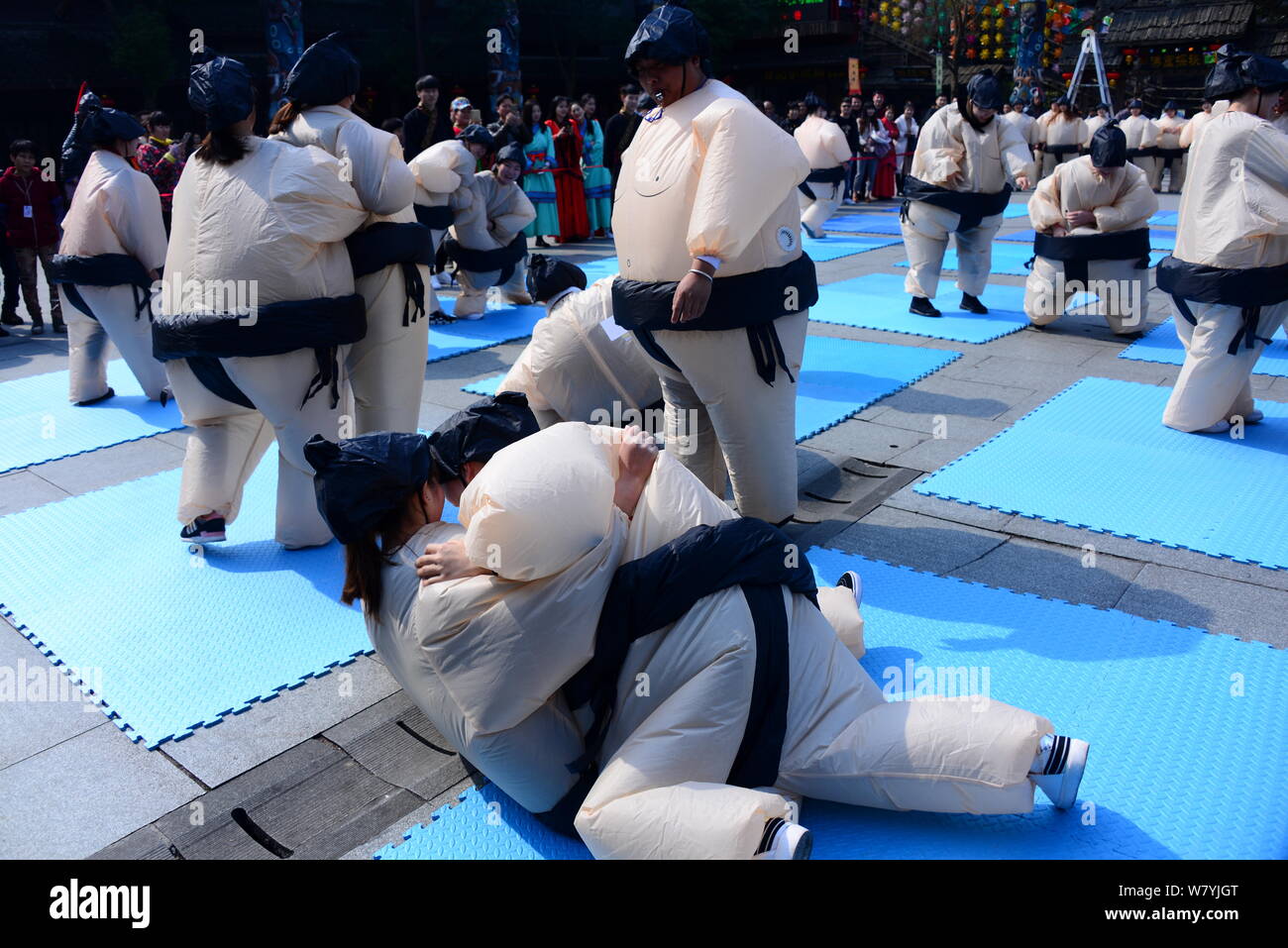 Chinese women dressed in inflatable sumo-wrestler costumes took part in ...