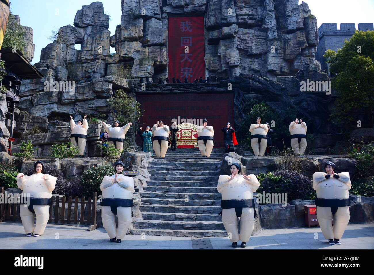 Chinese women dressed in inflatable sumo-wrestler costumes pose at ...