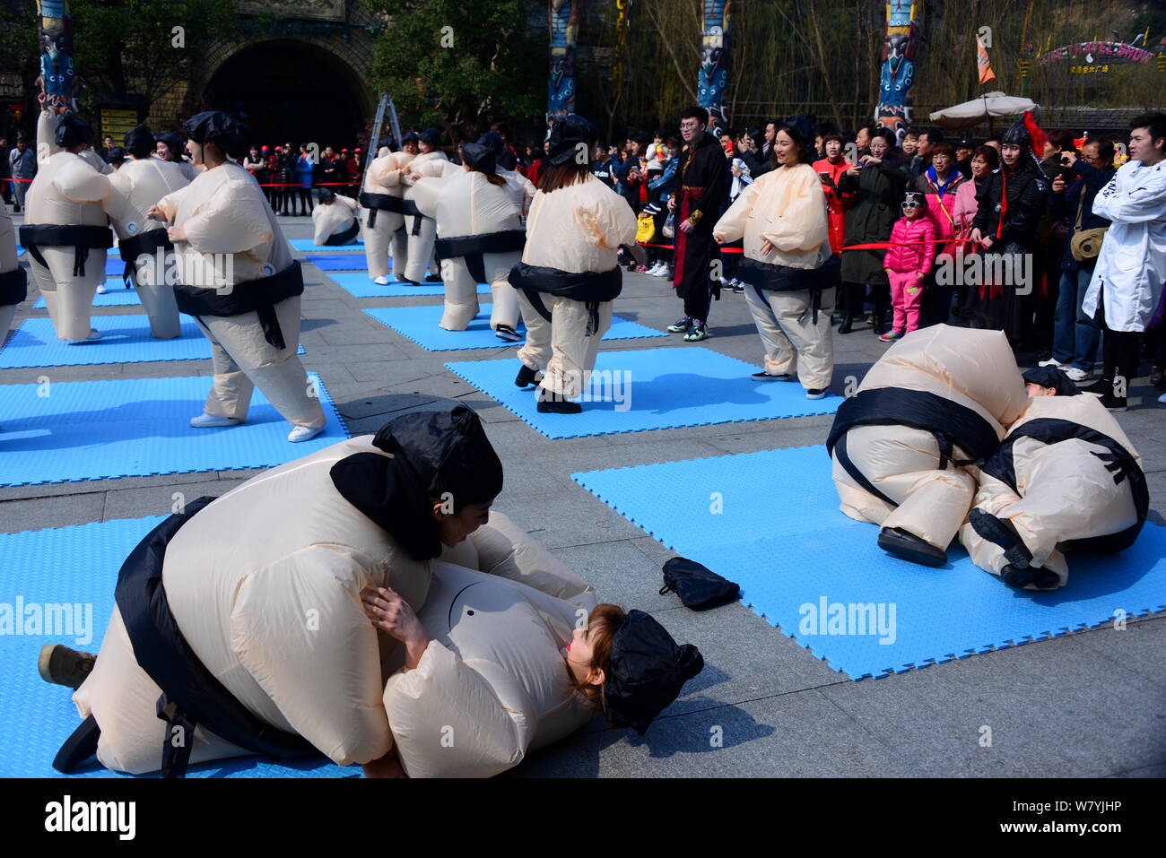 Chinese women dressed in inflatable sumo-wrestler costumes took part in ...