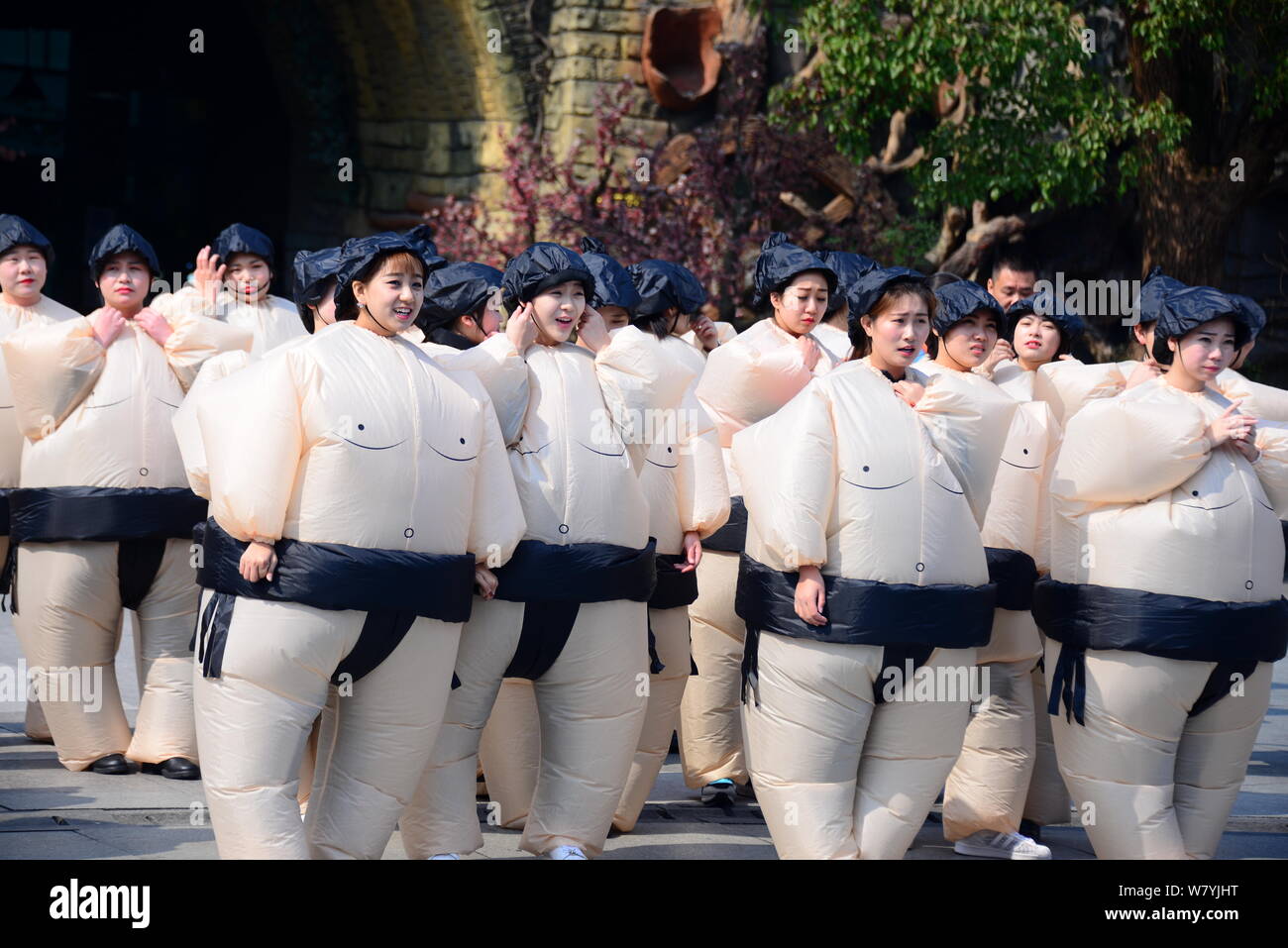 Chinese women dressed in inflatable sumo-wrestler costumes took part in ...