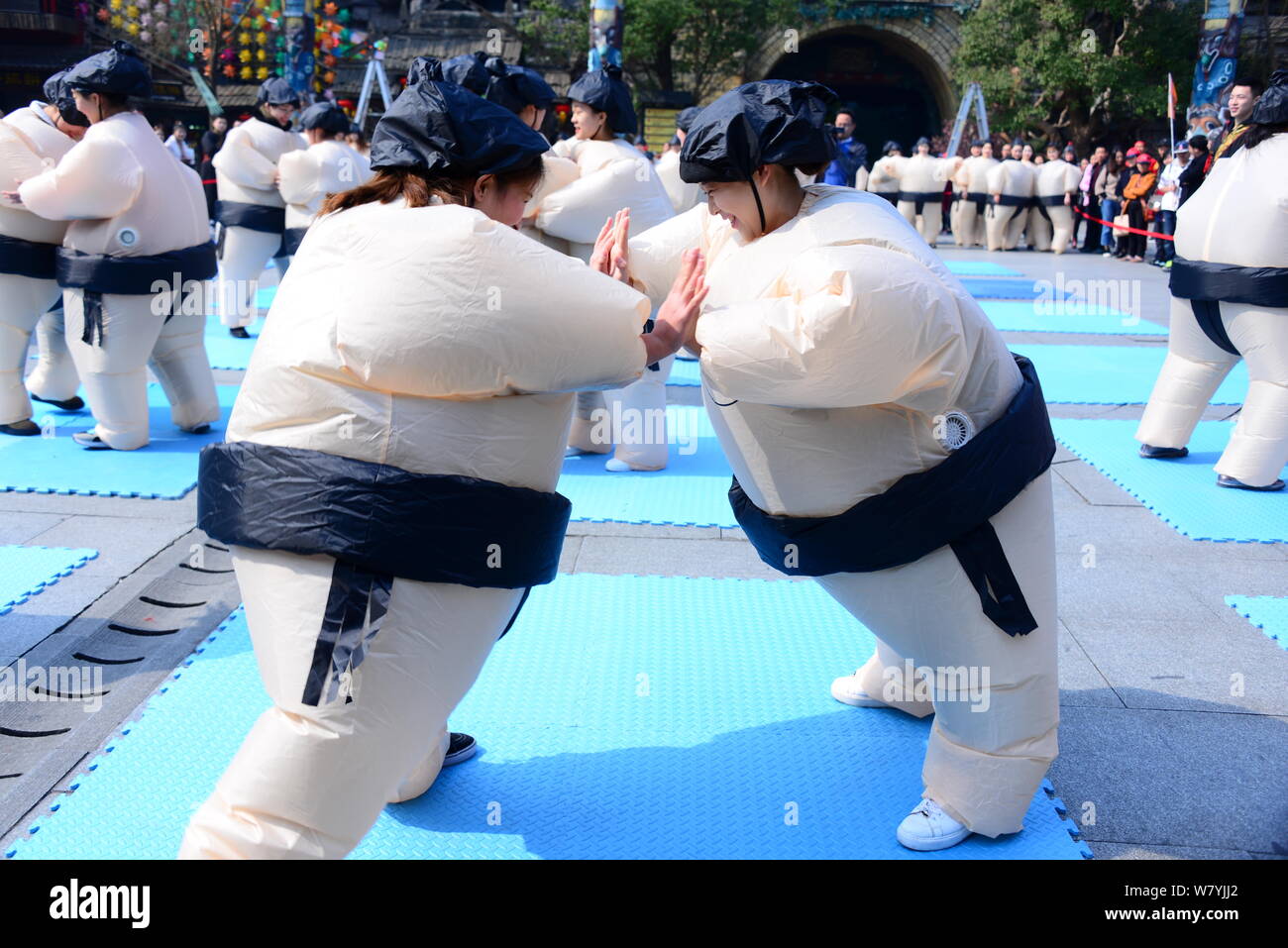 Chinese Women Dressed In Inflatable Sumo Wrestler Costumes Took Part In A Wrestling Contest At