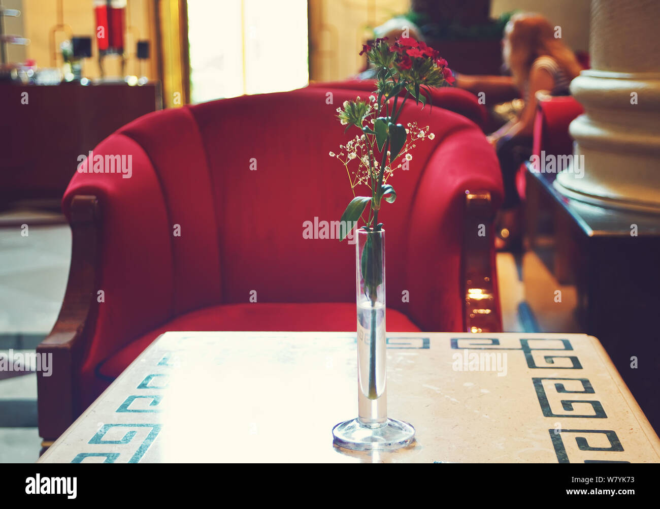 Hotel lobby lounge interior with red armchair and small table Stock ...