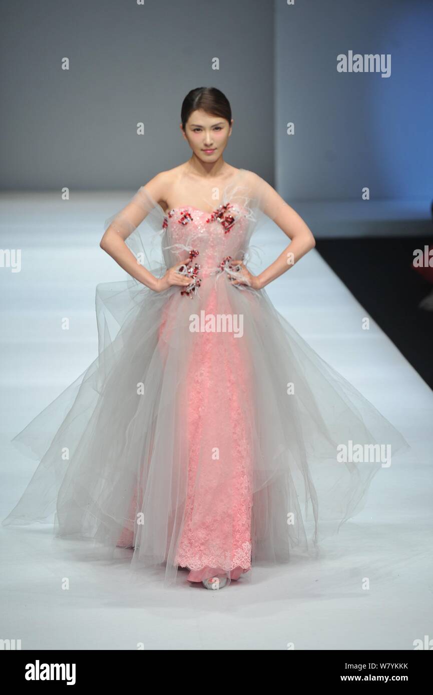 A model displays a new creation at the fashion show of Mija Design by ...