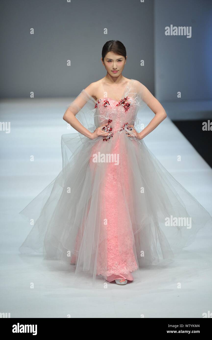 A model displays a new creation at the fashion show of Mija Design by ...