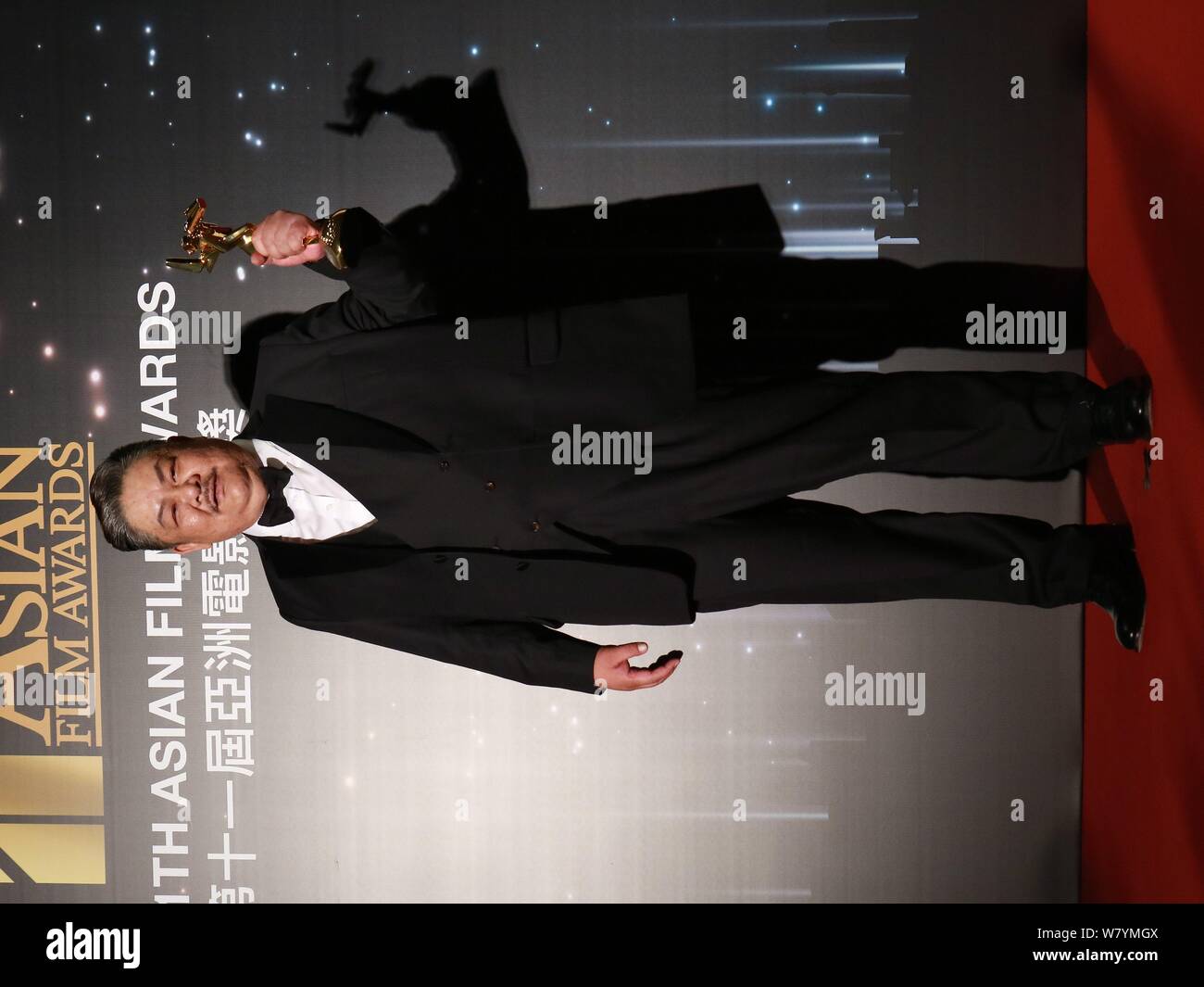 Hong Kong actor Lam Suet poses with his trophy after winning the Best ...