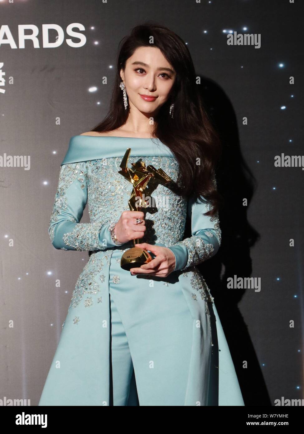 Chinese actress Fan Bingbing poses with her trophy after winning the ...