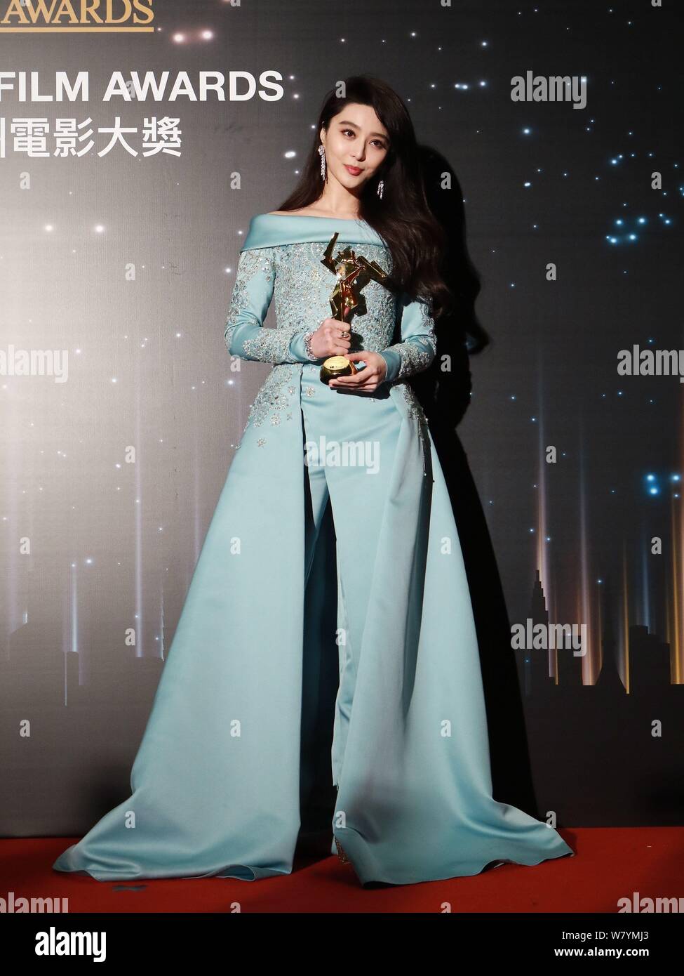 Chinese actress Fan Bingbing poses with her trophy after winning the ...