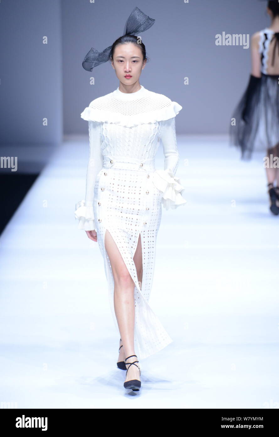 A model displays a new creation at the fashion show of CC by Chinese ...