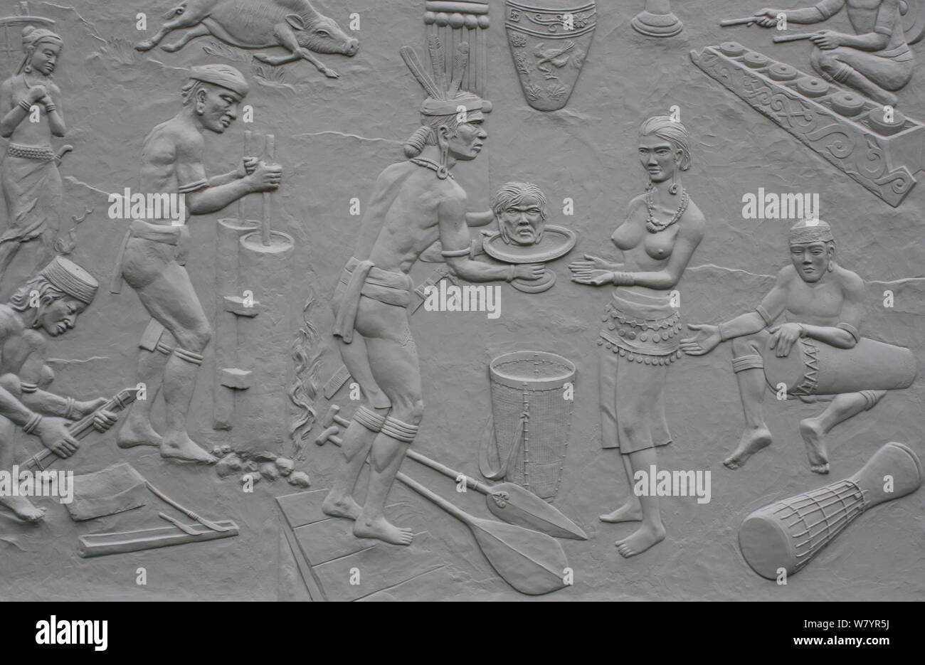 Mural outside museum in Pontianak showing scenes from daily life of ...