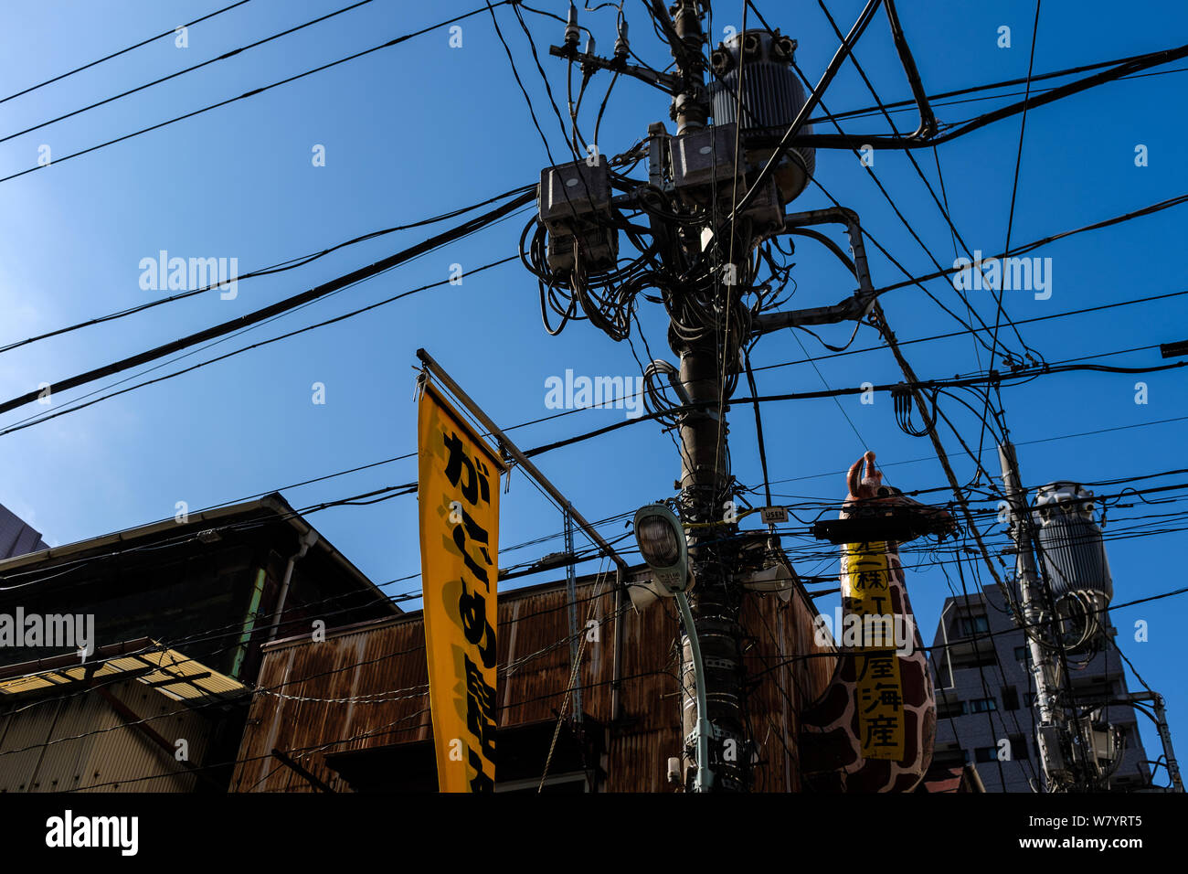 Cables running through a pole in Tokyo, Japan Stock Photo - Alamy