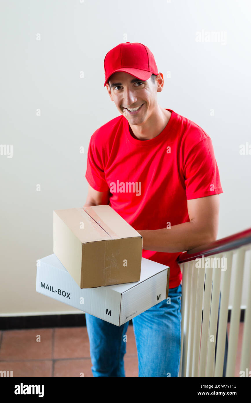 Young caucasian man holding package hi-res stock photography and images ...