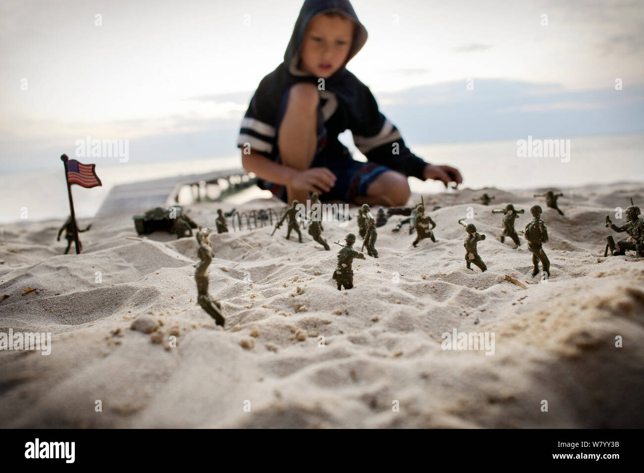 Boy with toy soldiers hi-res stock photography and images - Alamy